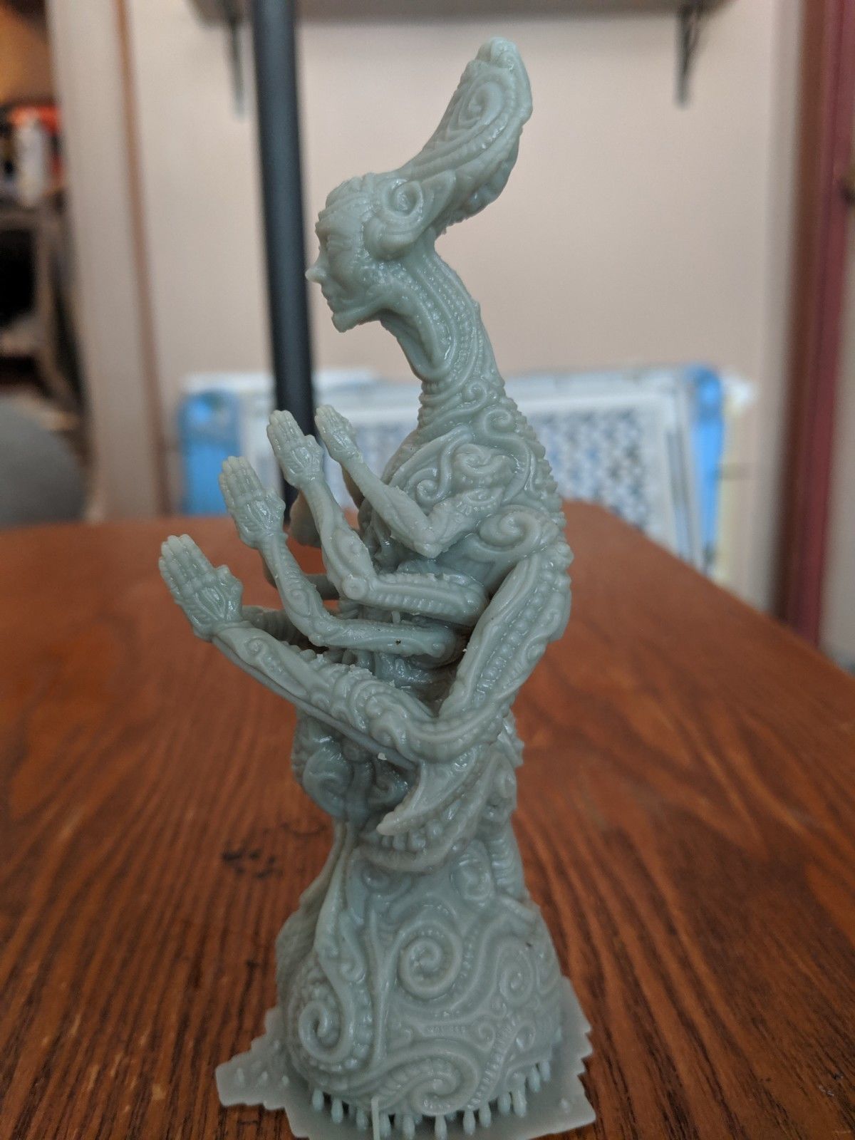 Greeter statue of woman on wooden table 3D model 3D printable | CGTrader