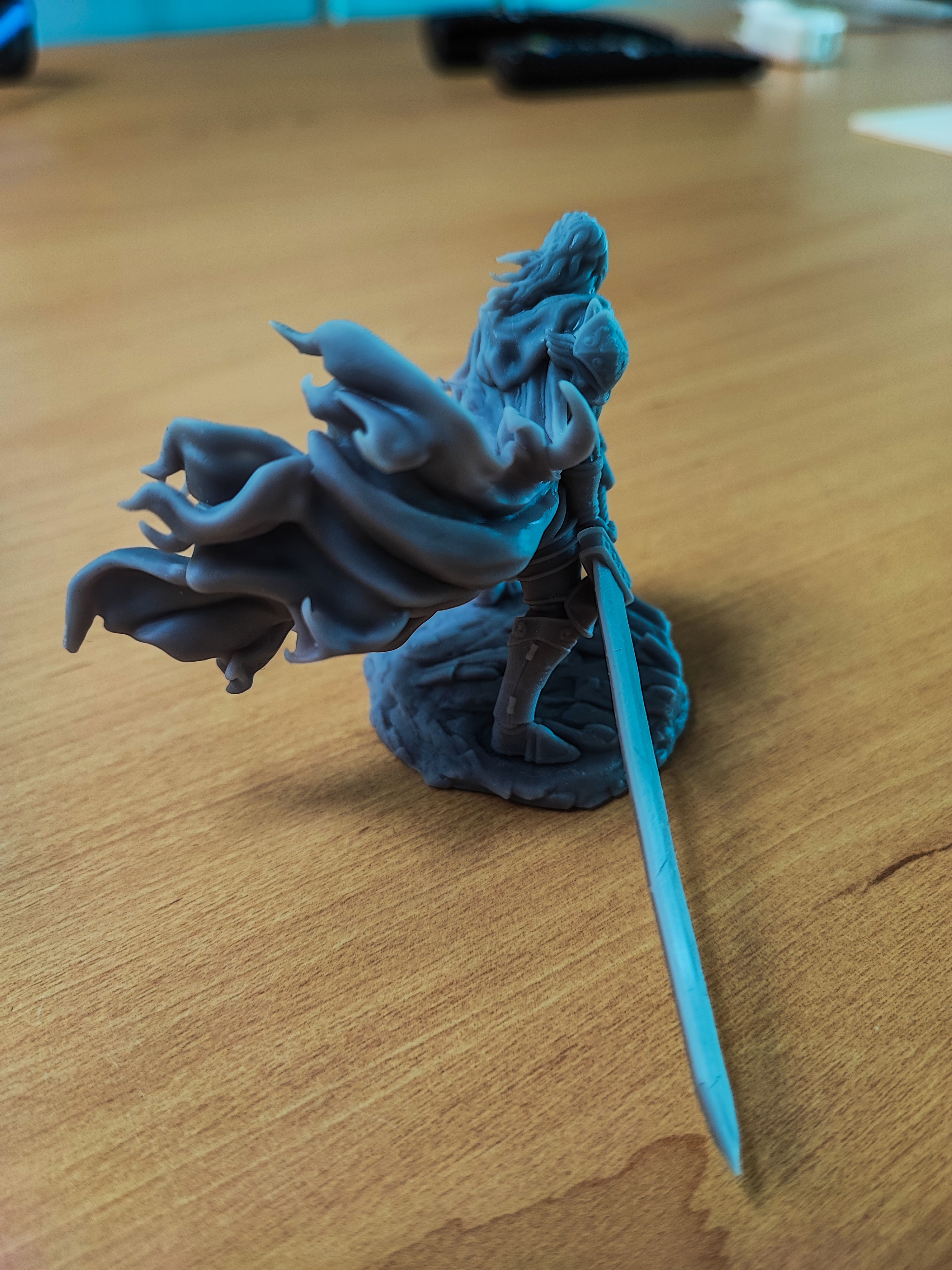 Avalord figure holding sword on table 3D model 3D printable | CGTrader